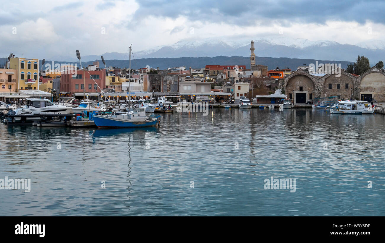 Chania Old Town Harbour View in Winter with snow on the mountains ...