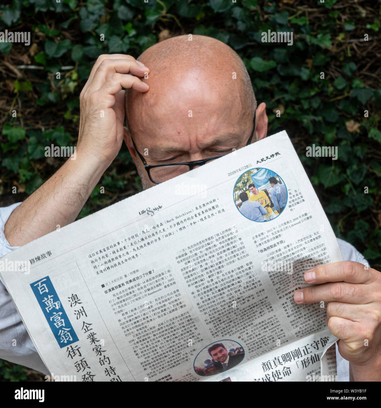 Chinese Man Reading Paper High Resolution Stock Photography and Images ...