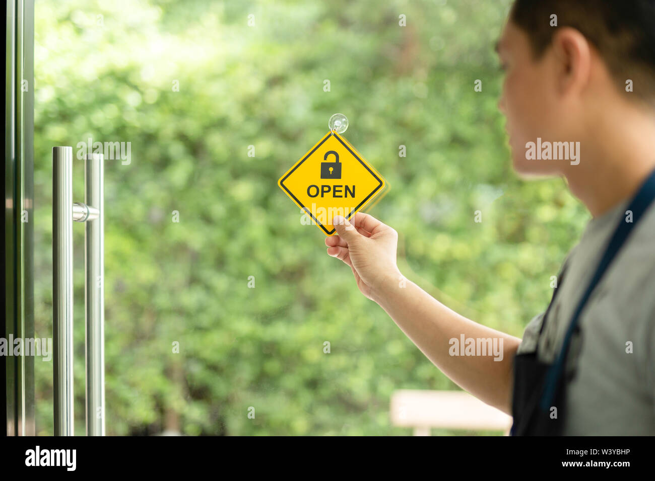 Small business owner hand holding open sing at coffee shop Stock Photo ...