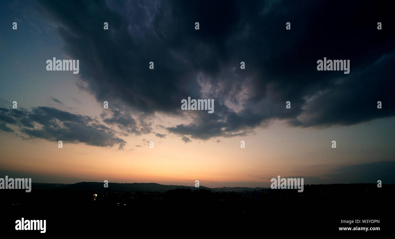 Beautiful sunset sky above clouds with dramatic light Stock Photo - Alamy
