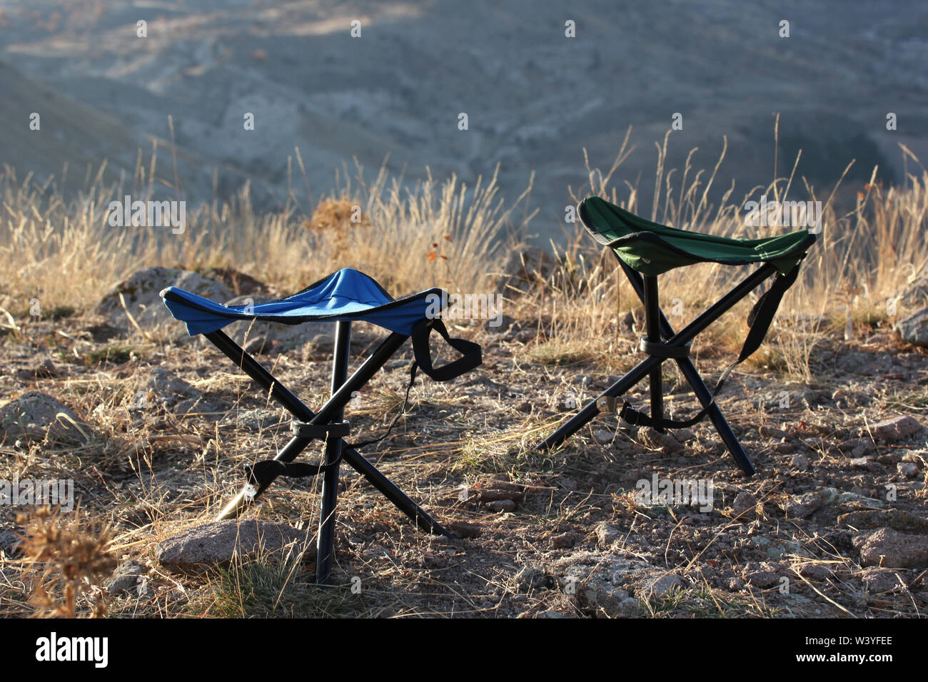 portable camping chairs in nature Stock Photo - Alamy