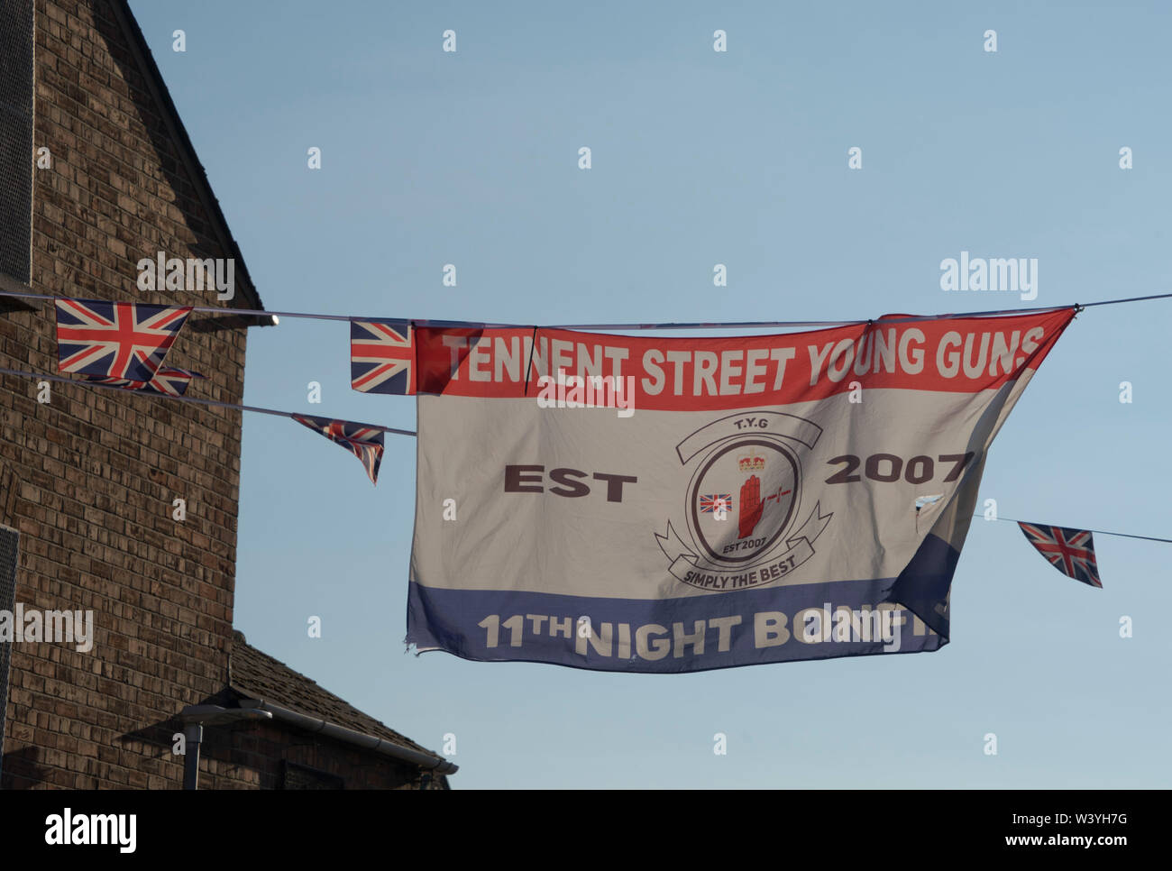 Loyalist flags and Tennent Street Young Guns gang banners in the ...