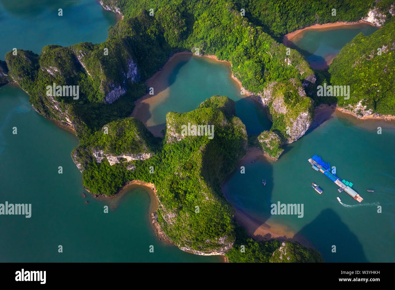 Aerial view of Luon cave and rock island, Halong Bay, Vietnam ...