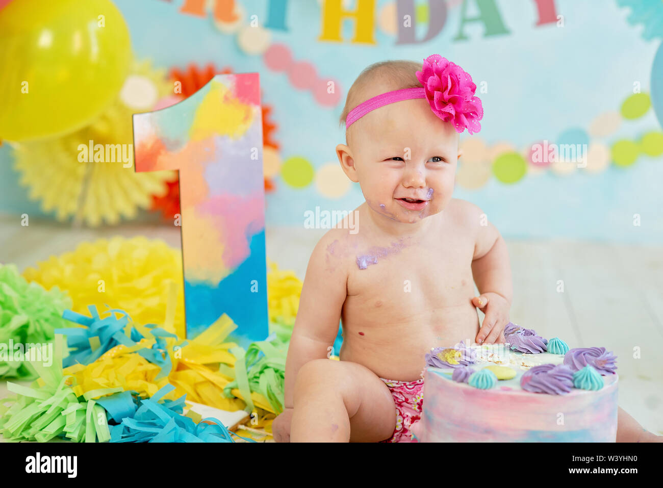 First birthday smash the cake. cream on legs. Festive background ...