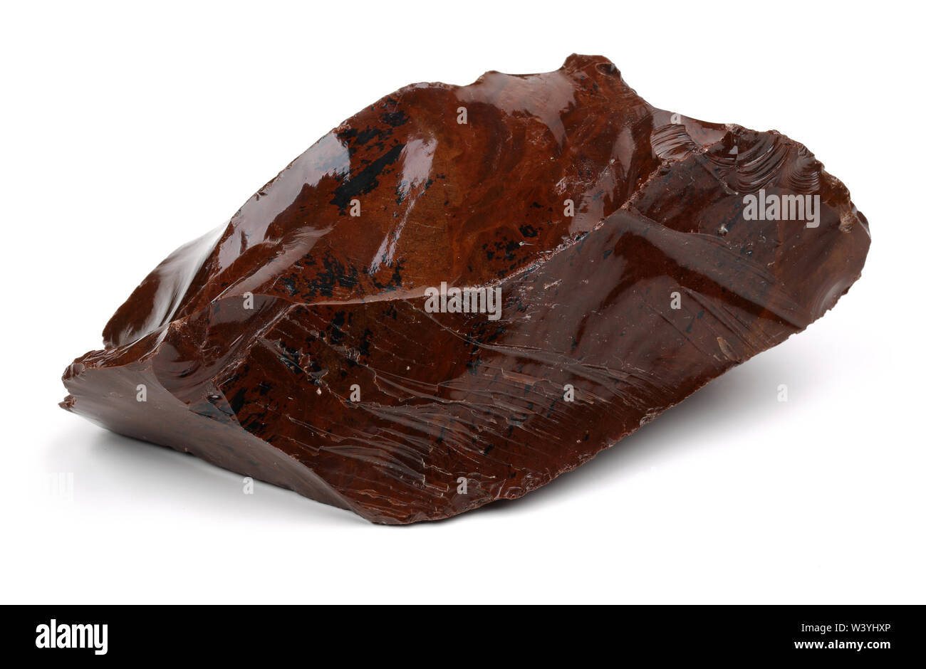 Brown obsidian piece isolated on white background Stock Photo - Alamy