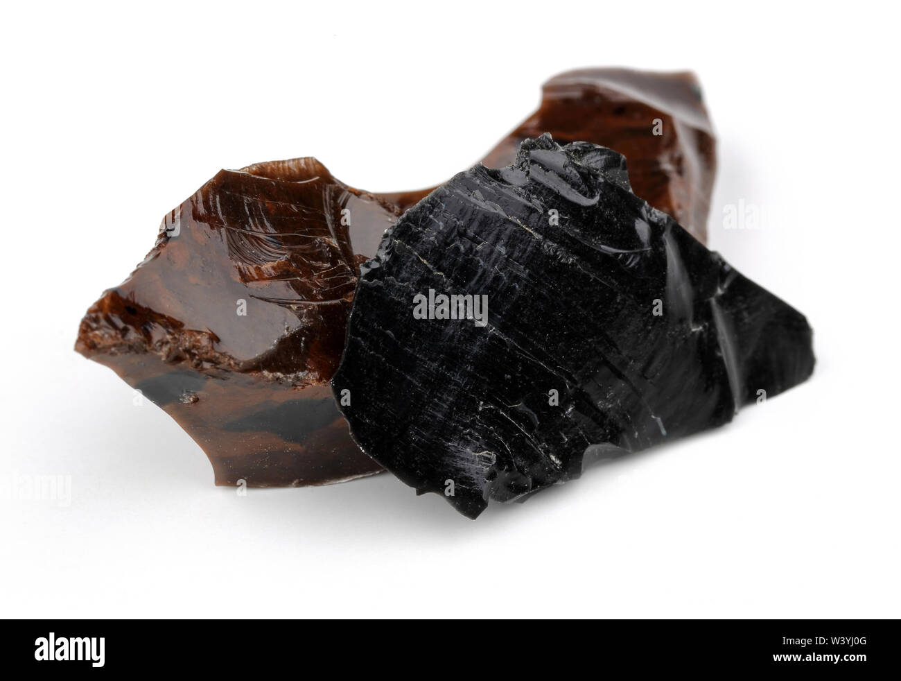 Brown and black obsidian pieces isolated on white background Stock ...