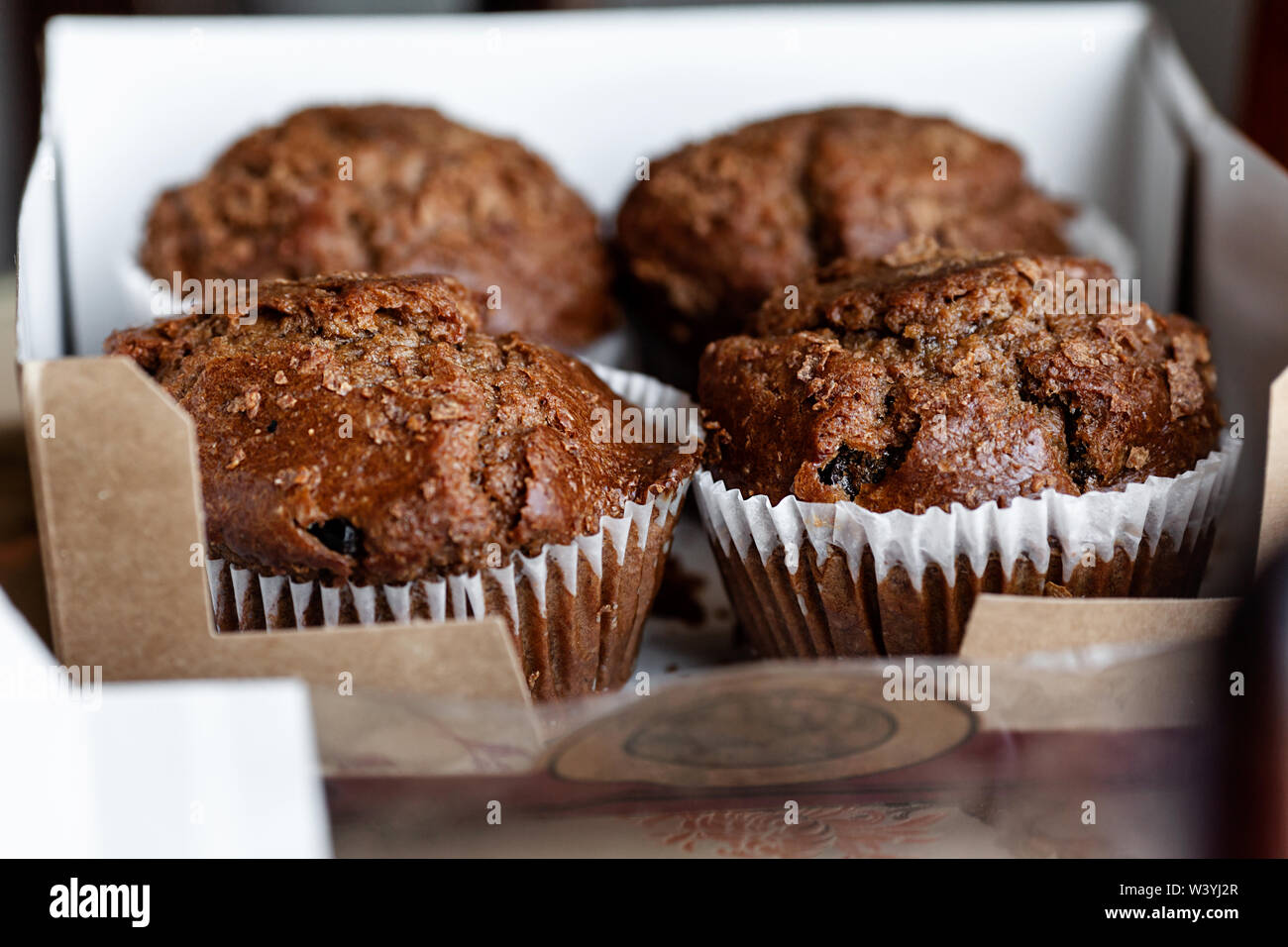 Chocolate muffins in a white paper box ready to eat - Image Stock Photo ...