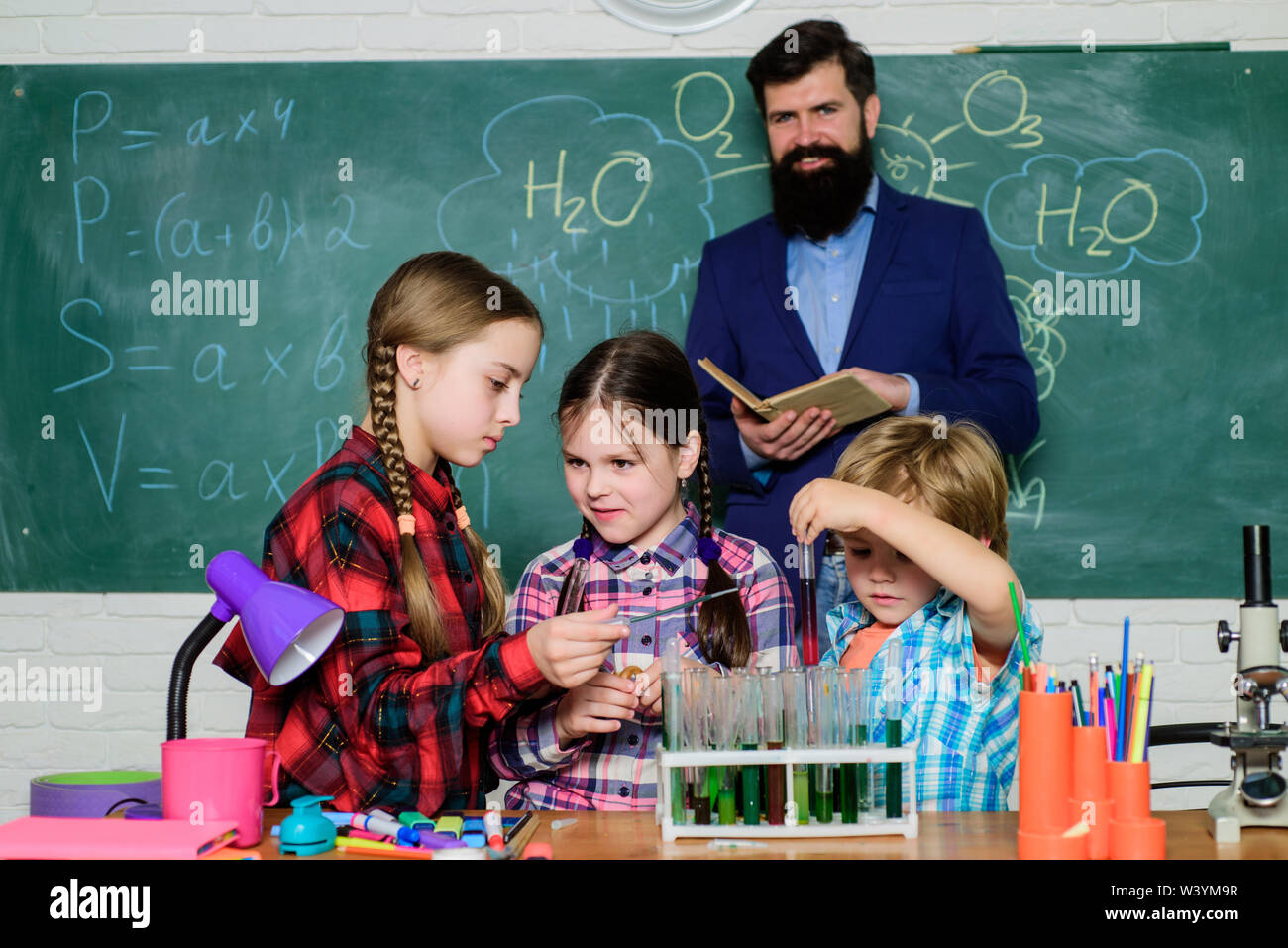 Medical team. doing experiments with liquids in chemistry lab ...