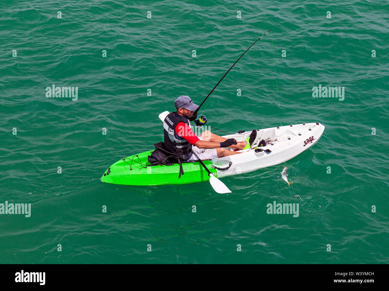 Man in kayak fishing hi-res stock photography and images - Alamy
