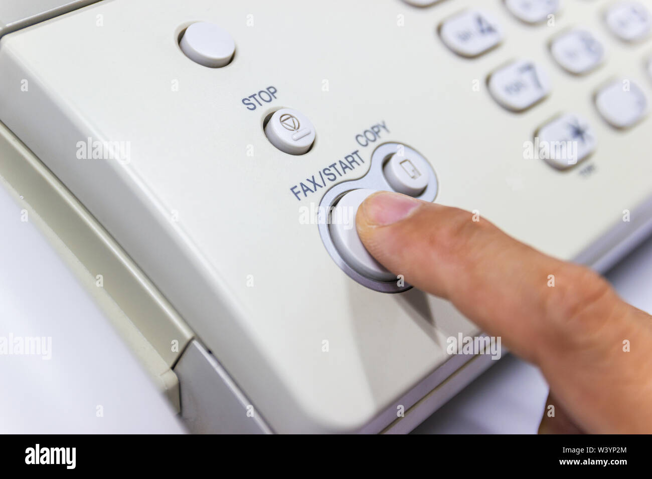 hand man are using a fax machine in the office Business concept Stock ...