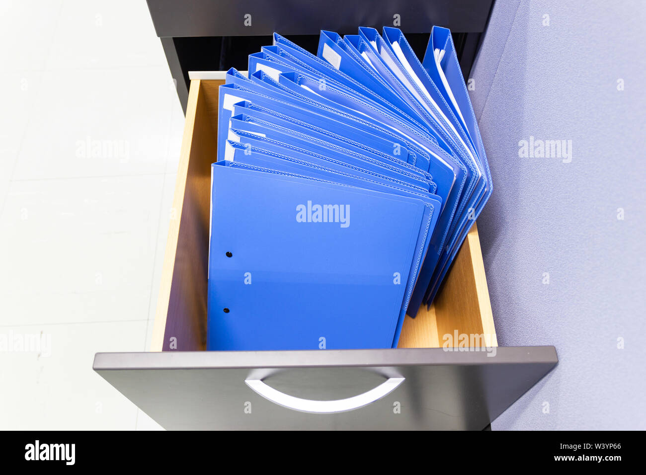blue file folder documents In a file cabinet retention of contracts ...