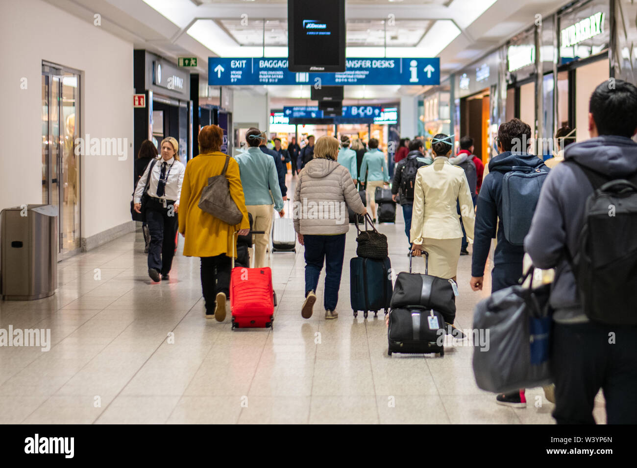 PRAGUE, CZECH REPUBLIC - 12TH APRIL 2019: Tourists and Airline crew ...