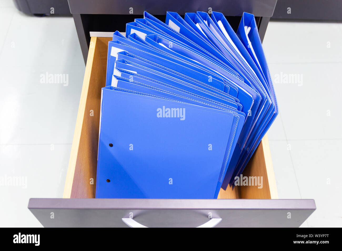 blue file folder documents In a file cabinet retention of contracts ...