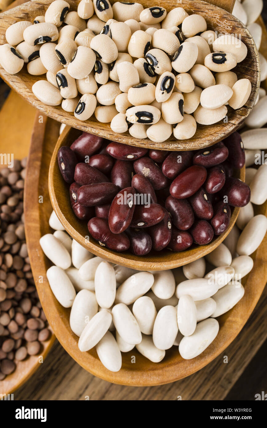closeup of types of dry beans in wooden bowls Stock Photo - Alamy