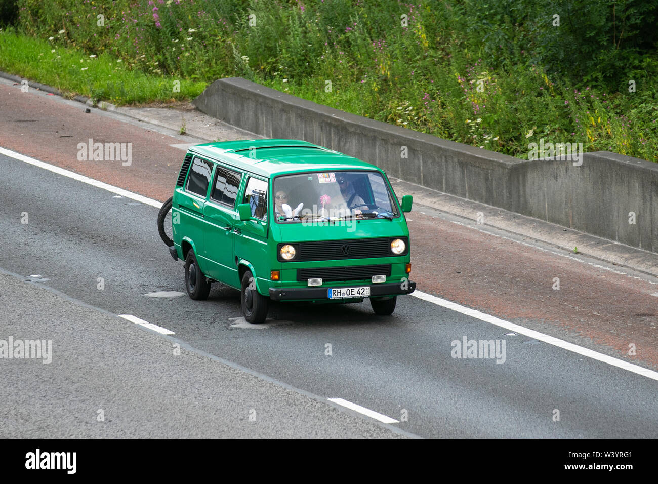Green VW Volkswagen camper van; UK Vehicular traffic, transport, modern ...