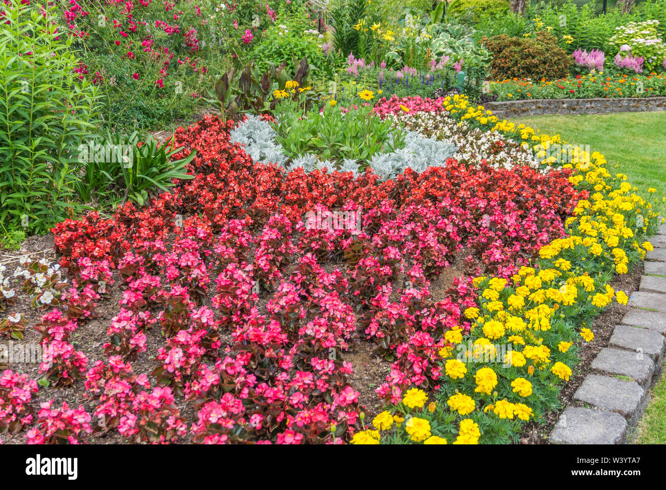 A view of a lawn and flower garden at Point Defiance Park in Tacoma ...
