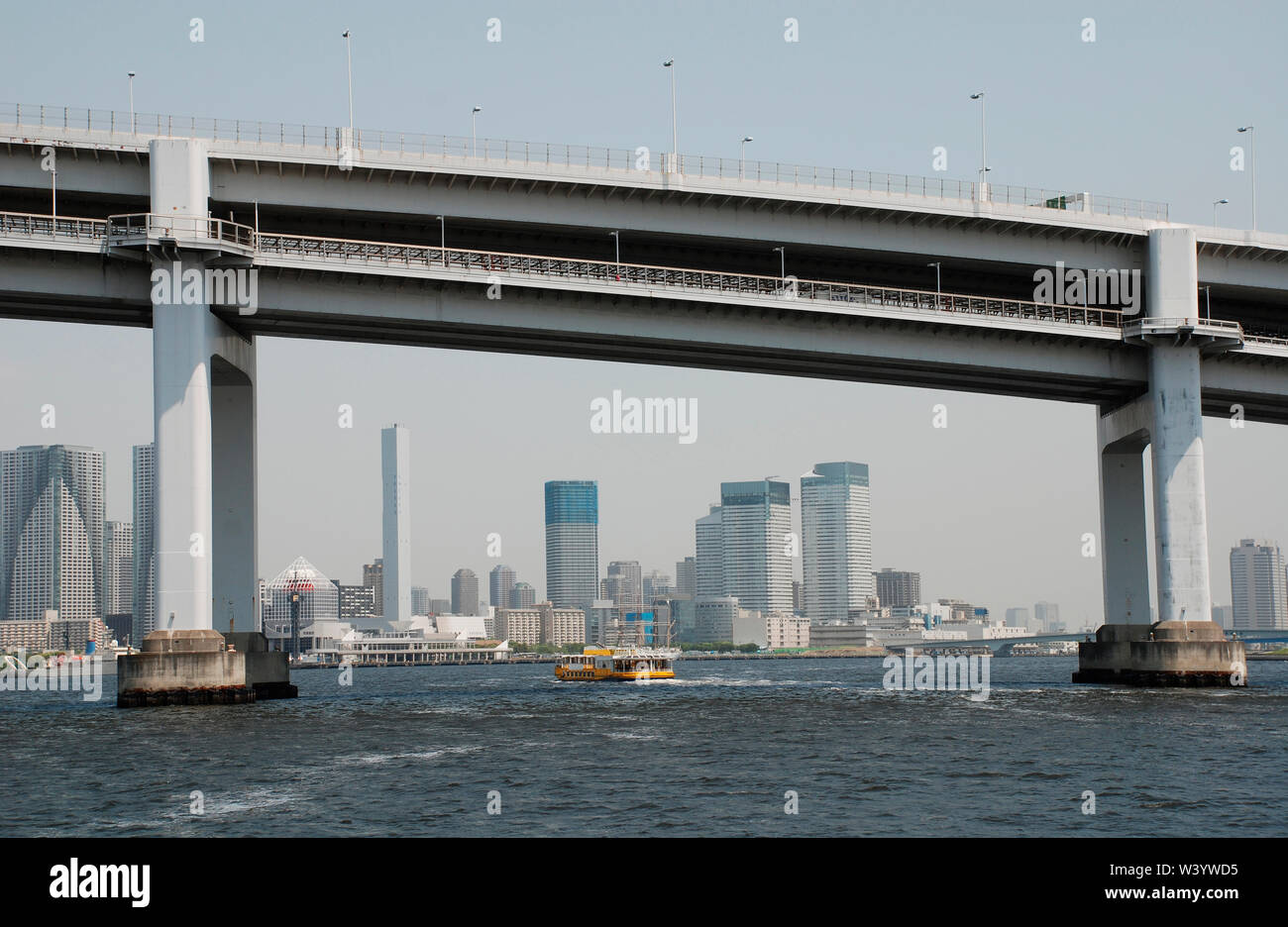 A large modern bridge crosses one of Tokyo's waterways Stock Photo - Alamy