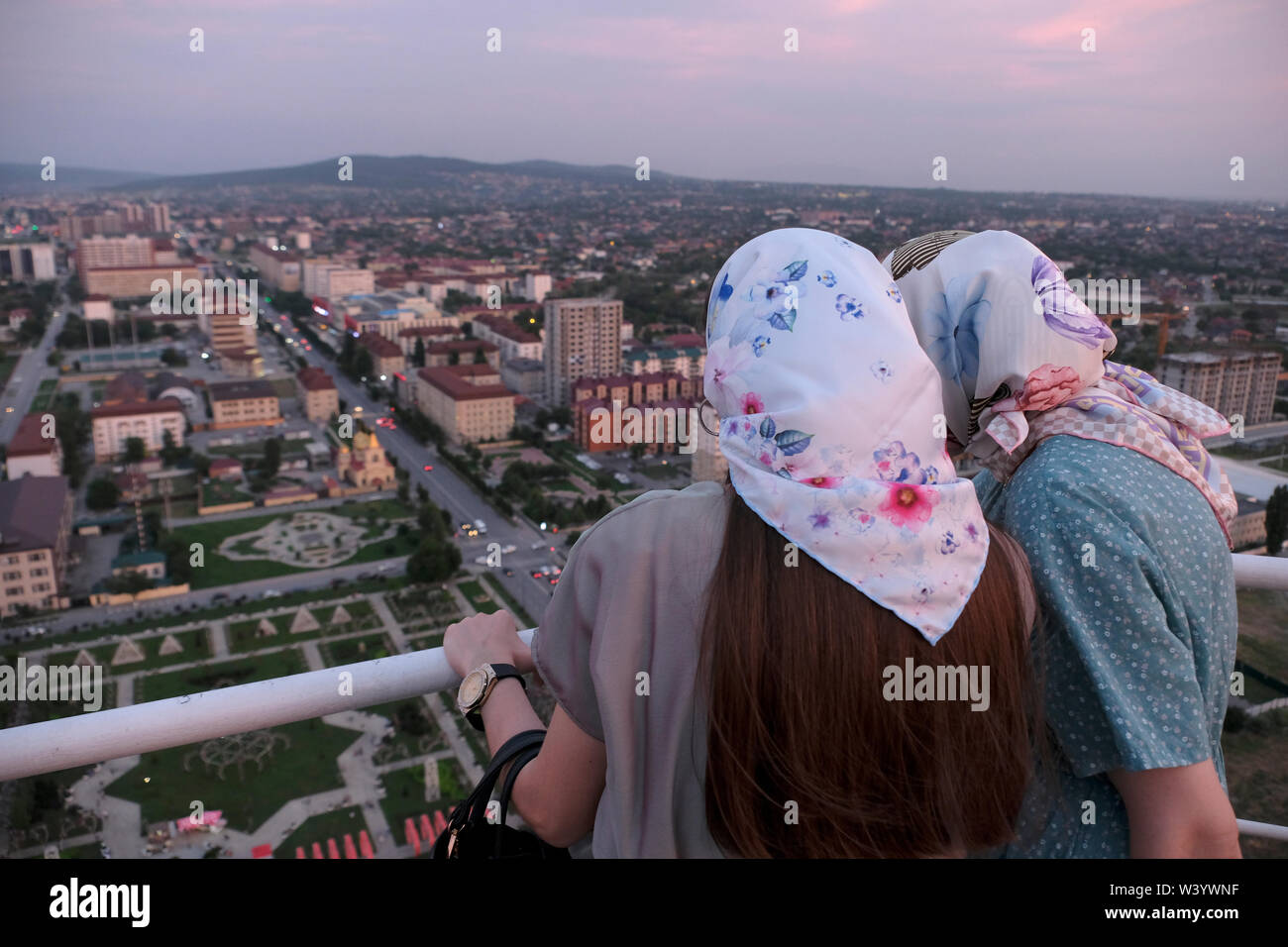 Chechen women gazing from an observation point of a skyscraper in ...