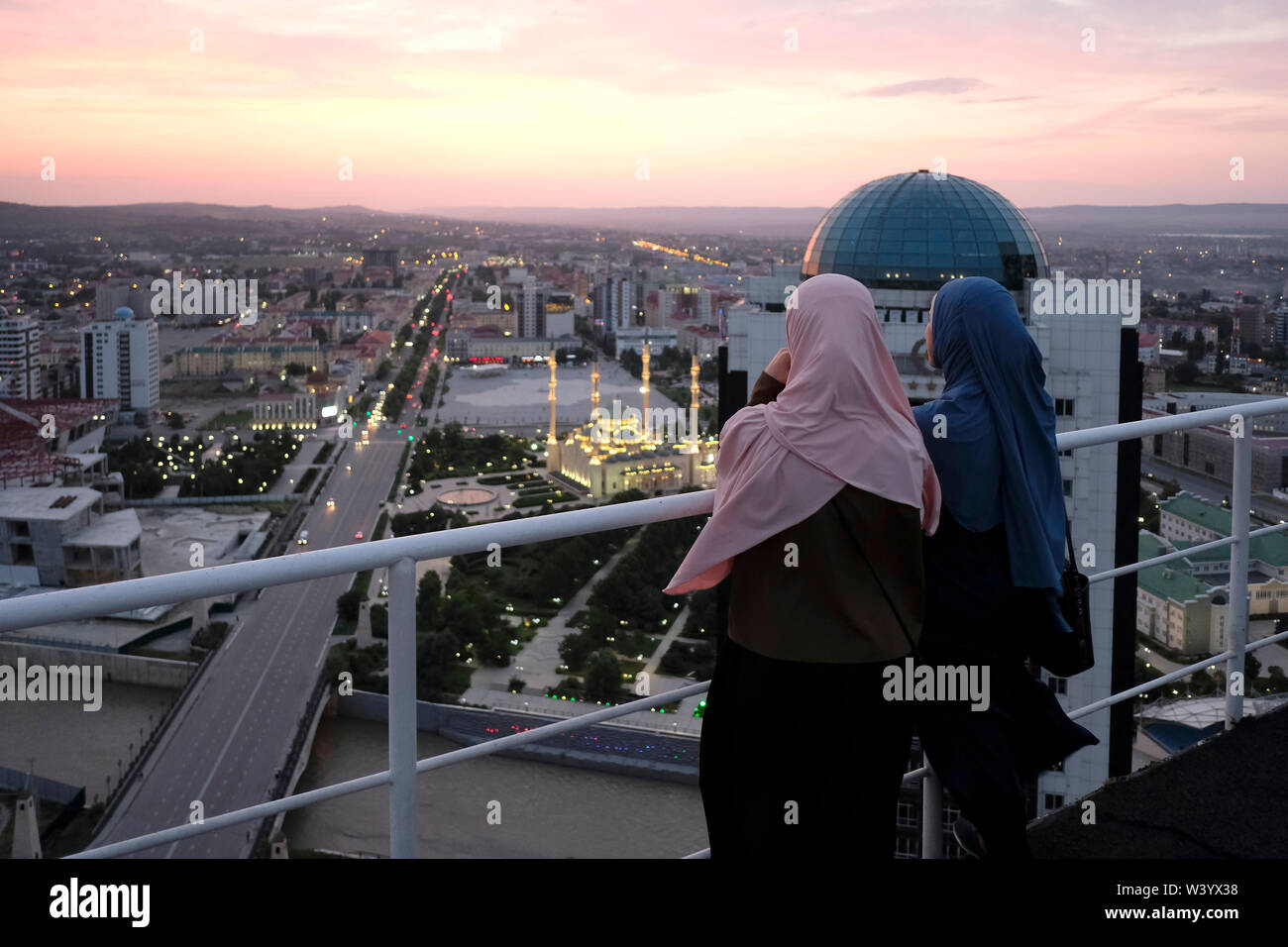 Chechen women gazing from an observation point of a skyscraper in ...