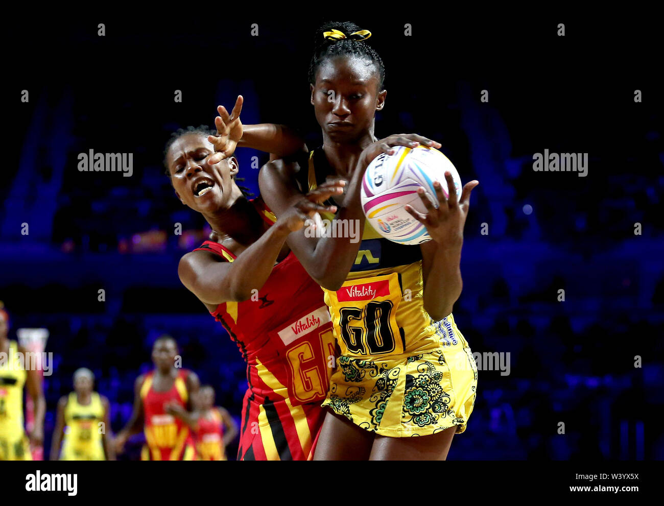 Jamaica's Jodiann Ward (left) and Uganda's Joan Nampungu in action ...