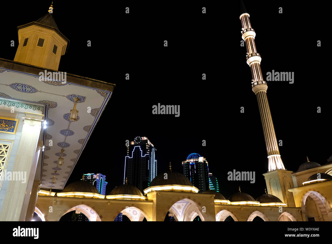 View of Akhmad Kadyrov Mosque illuminated at night in Grozny the ...