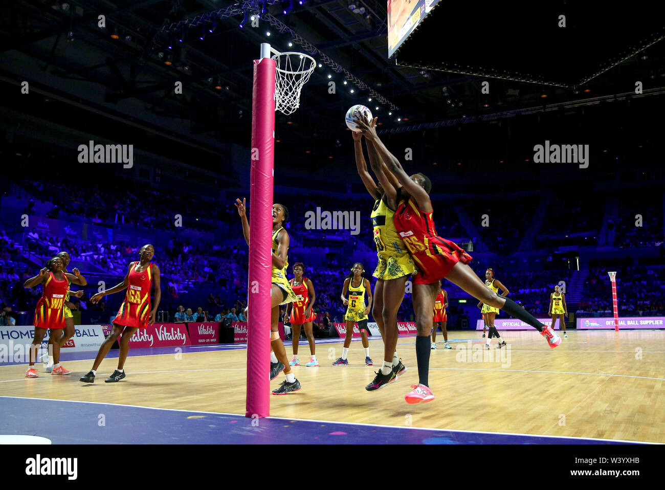 Jamaica's Jodiann Ward and Uganda's Peace Proscovia in action during ...