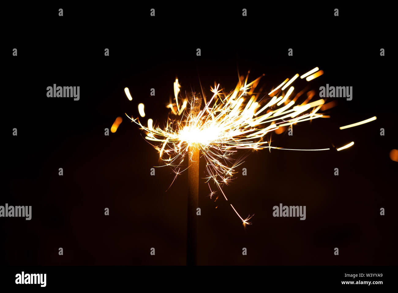 Burning Bengal New Year's fire on a black background Stock Photo - Alamy