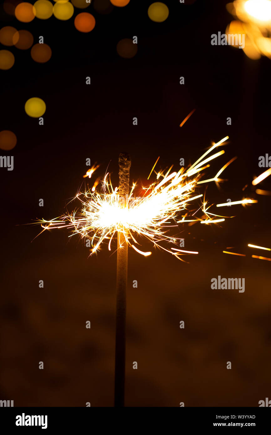 Burning Bengal New Year's fire on a black background Vertical Stock ...