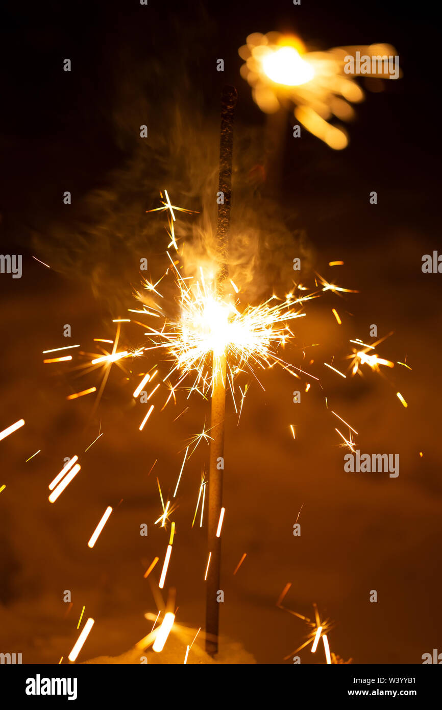 Burning Bengal New Year's fire on a black background Vertical Stock ...