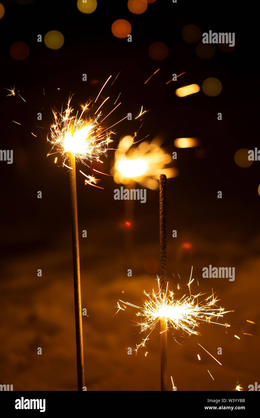 Burning Bengal New Year's fire on a black background Vertical Stock ...