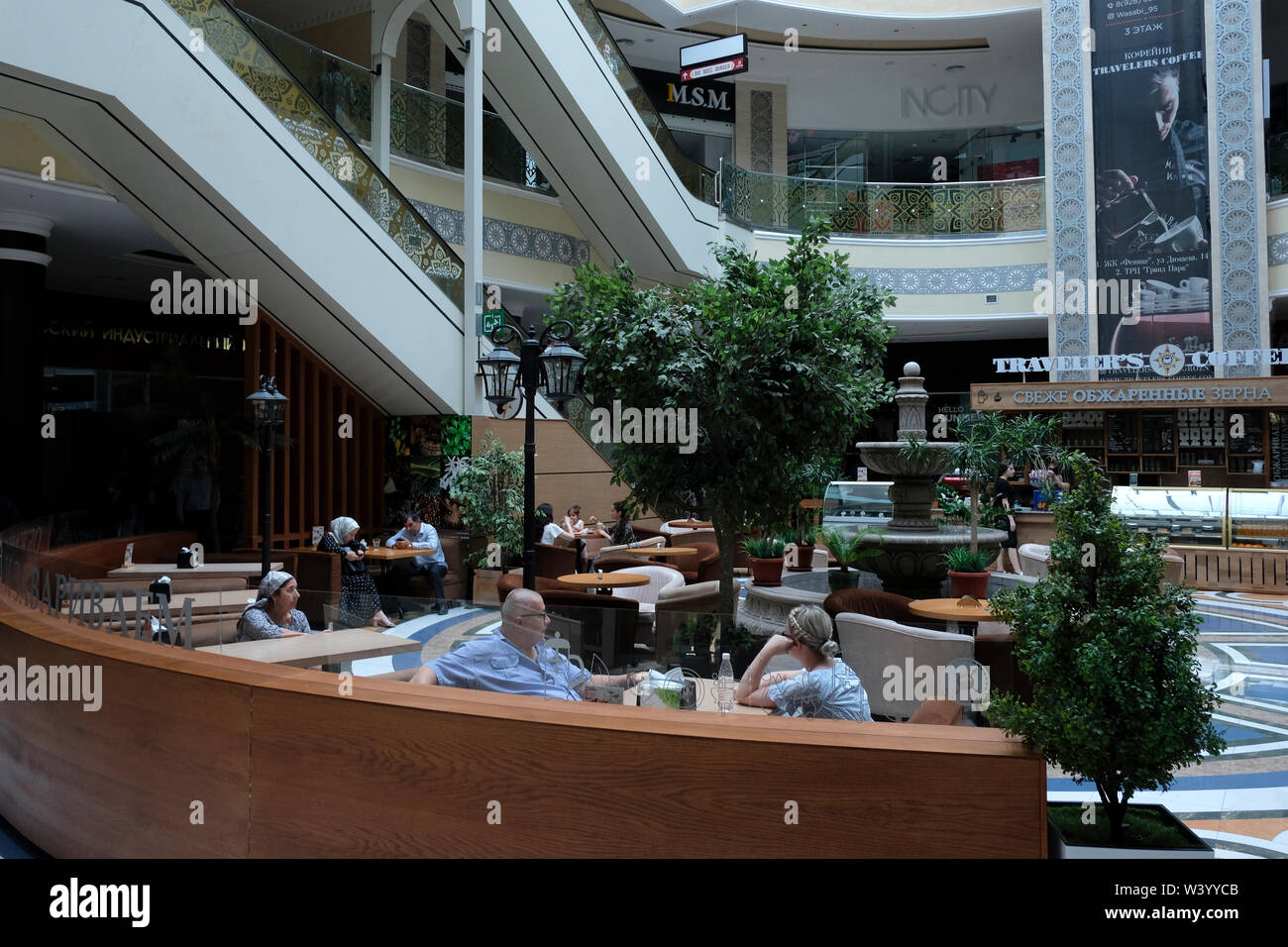 People sitting in a restaurant inside a shopping mall in Grozny the ...