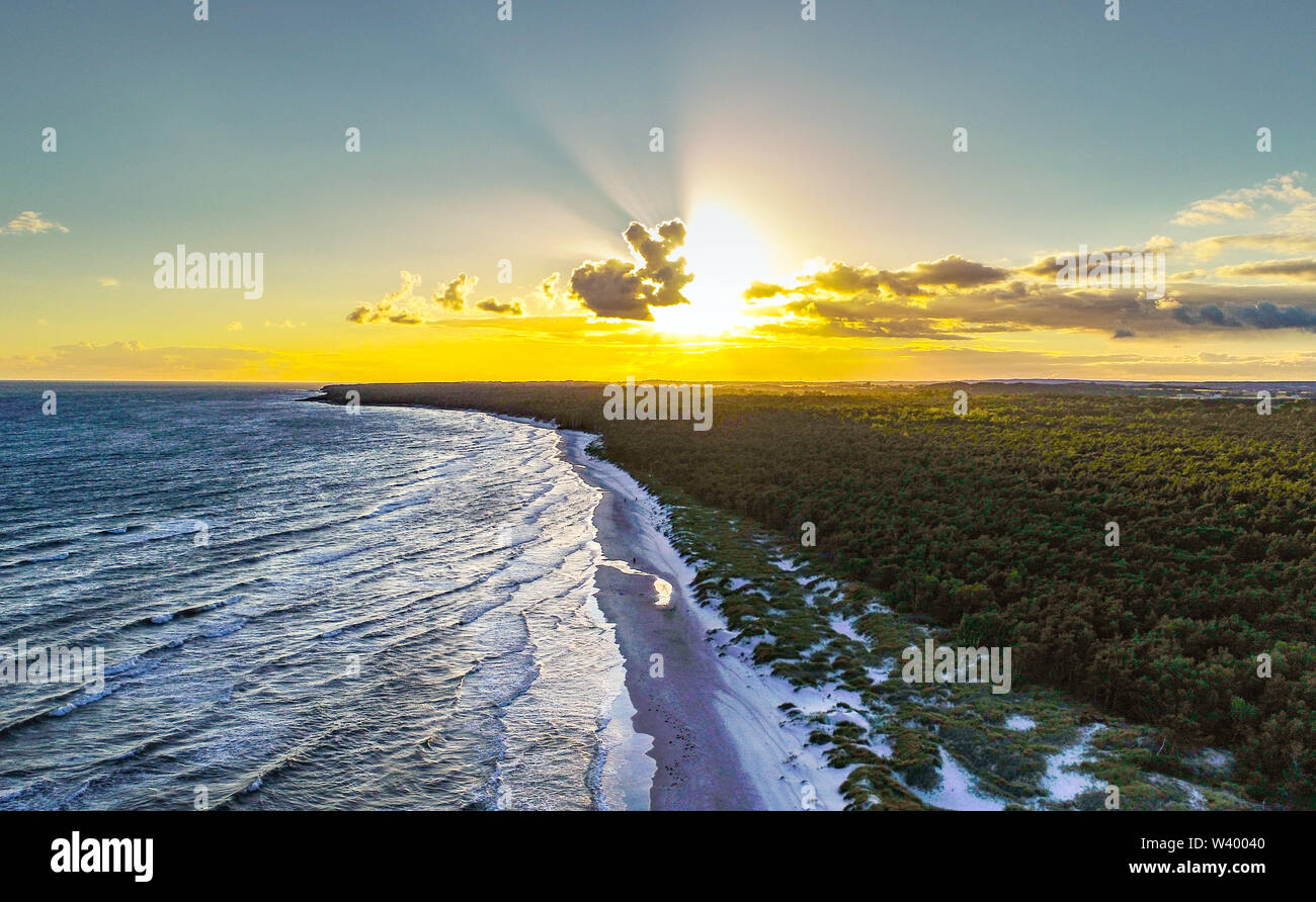 03 July 2019, Denmark, Dueodde: Sunset at the southeast tip of the ...