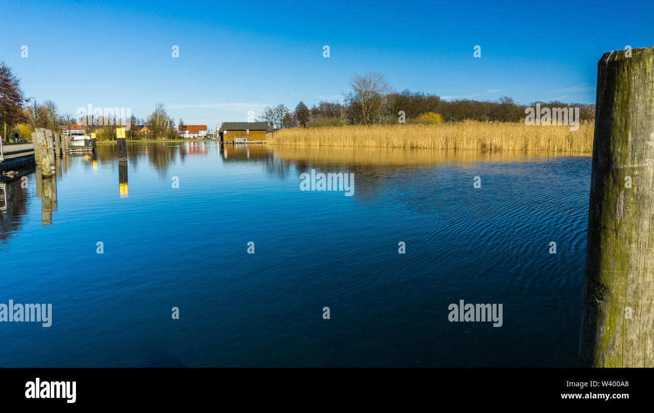 still river with boathouses Stock Photo - Alamy