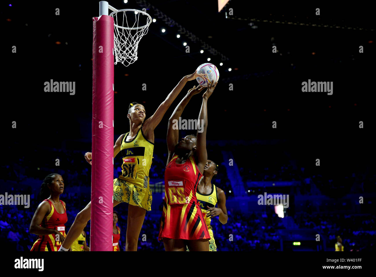 Jamaica's Shamera Sterling and Uganda's Peace Proscovia in action ...