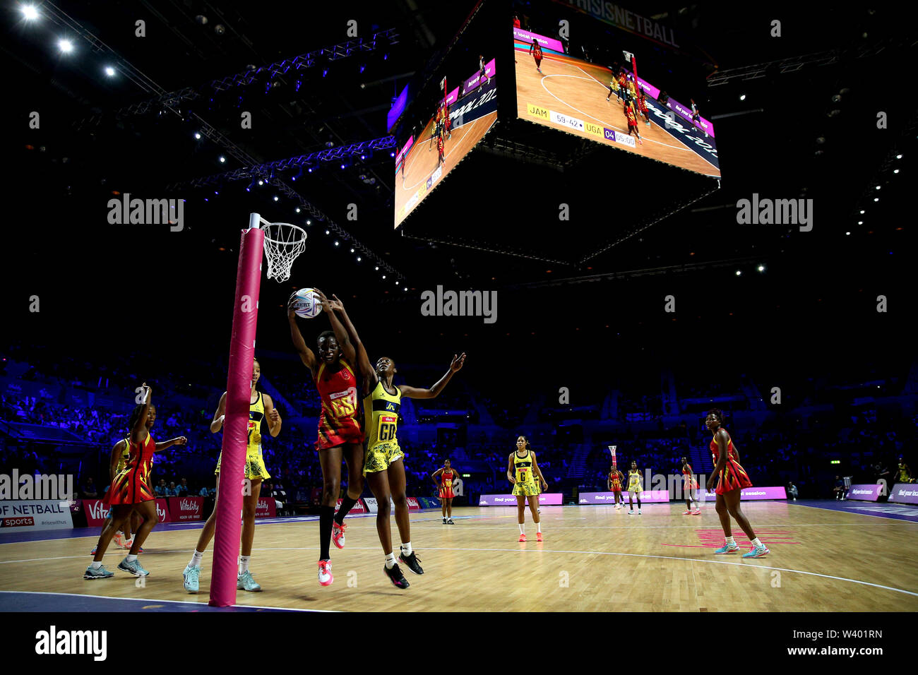 Jamaica's Jodiann Ward and Uganda's Peace Proscovia in action during ...