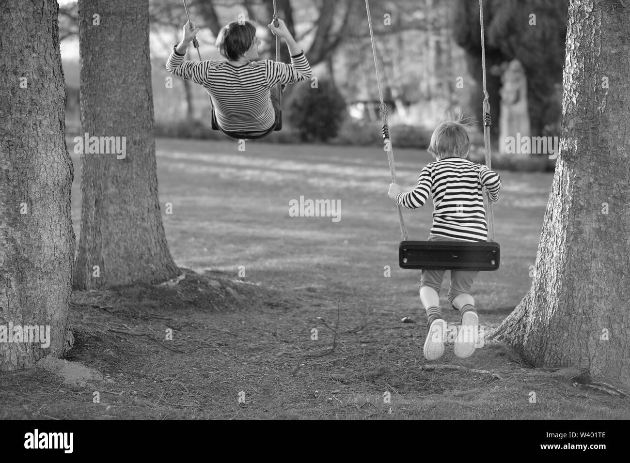Swinging hanging Black and White Stock Photos & Images - Alamy