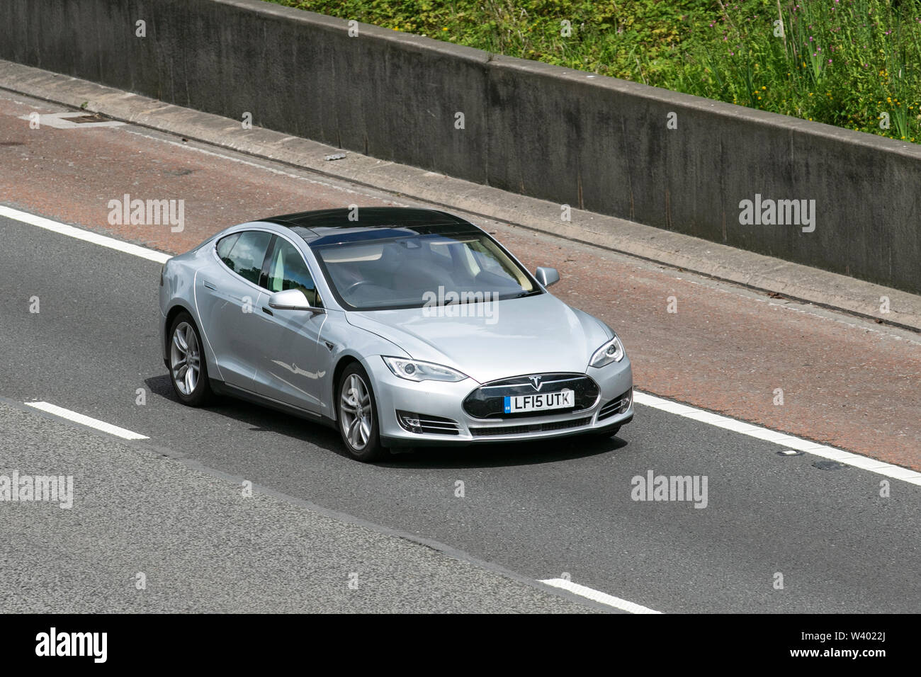 2015 silver Tesla Model S; UK electric car; Vehicular traffic ...