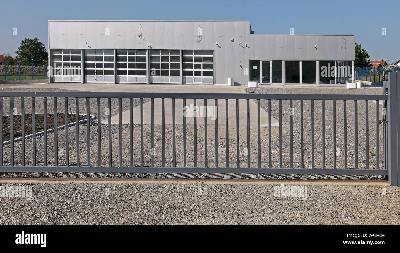 Closed Gate at New Garage Service Building Stock Photo - Alamy