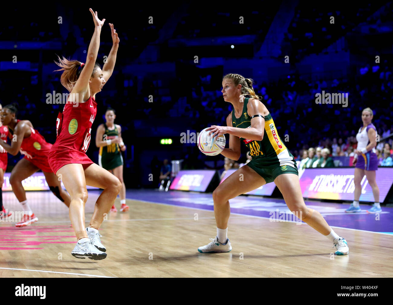 England's Jade Clarke (left) in action during the Netball World Cup ...