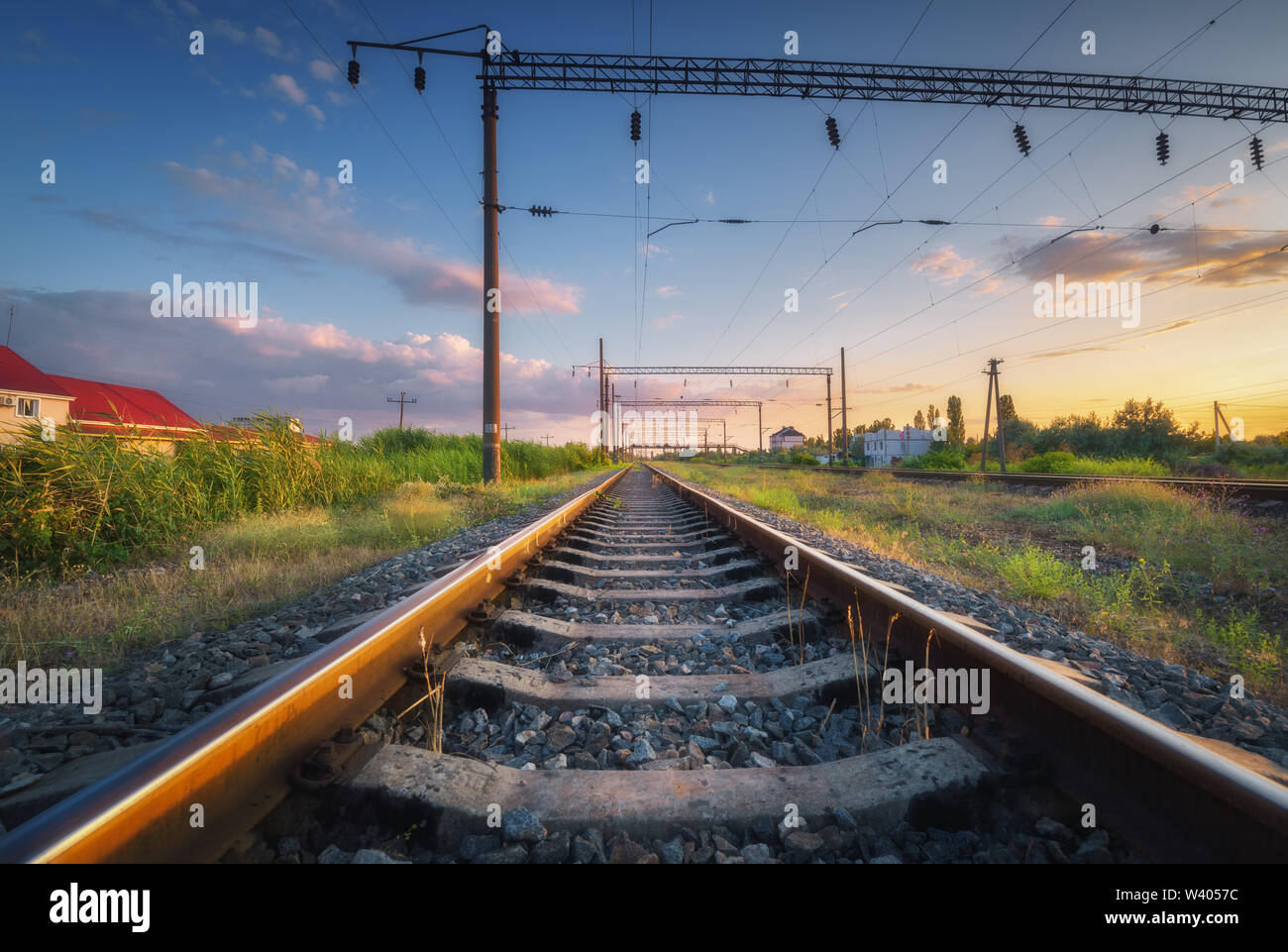 Railway station and beautiful sky at sunset. Railroad in summer Stock ...