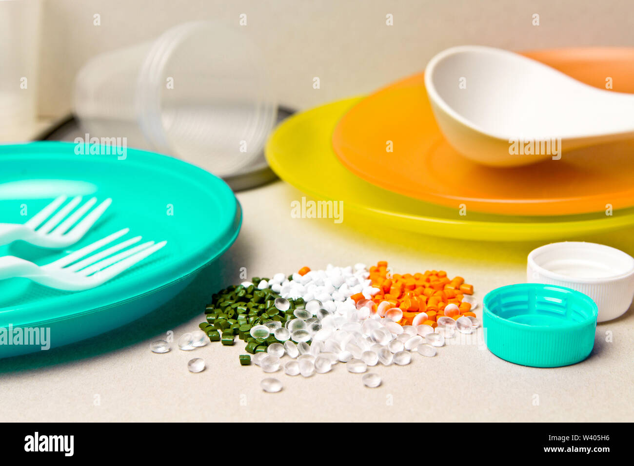 Plastic disposable tableware and Plastic Raw material. Colored granules ...
