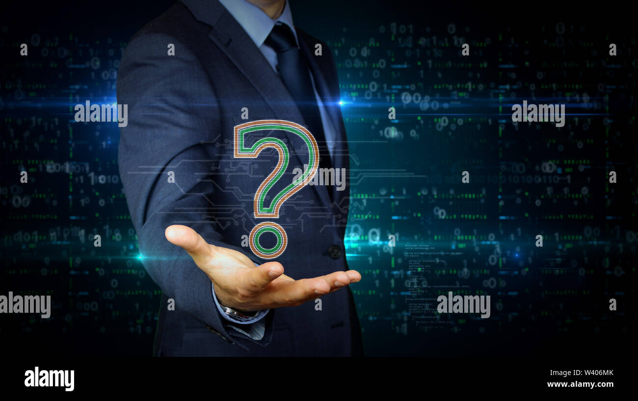 A businessman in a suit touch the screen with question mark symbol ...