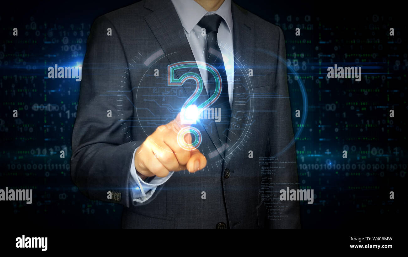 A businessman in a suit touch the screen with question mark symbol ... A businessman in a suit touch the screen with question mark symbol ...