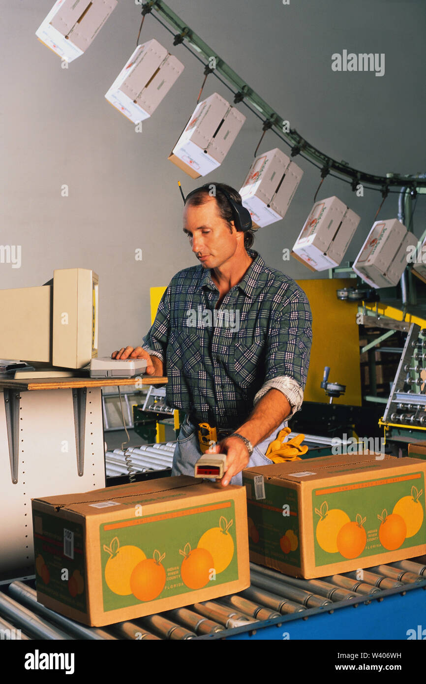 Smiling worker in manufacturing plant hi-res stock photography and ...