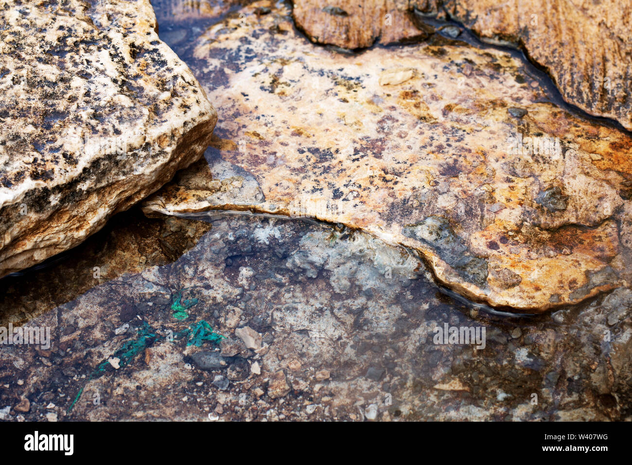 Puddle in the middle of the stones in the park on a summer day Stock ...