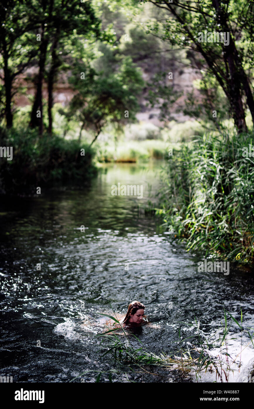 Woman bathing waterfall hi-res stock photography and images - Alamy