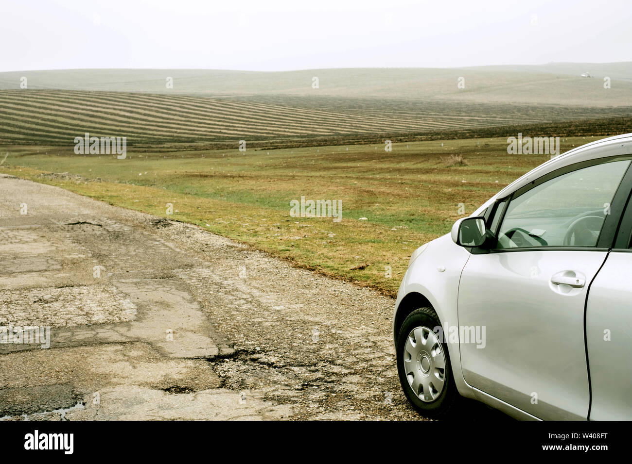 Road trip car on scenic drive hill landscape Stock Photo - Alamy