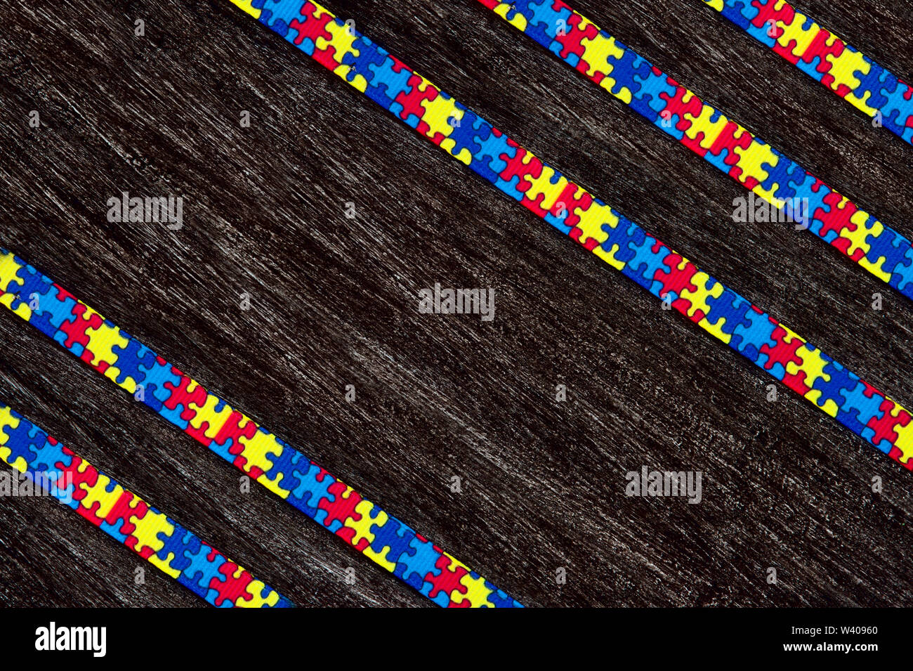 World Autism awareness day with Puzzle ribbon on wooden background ...