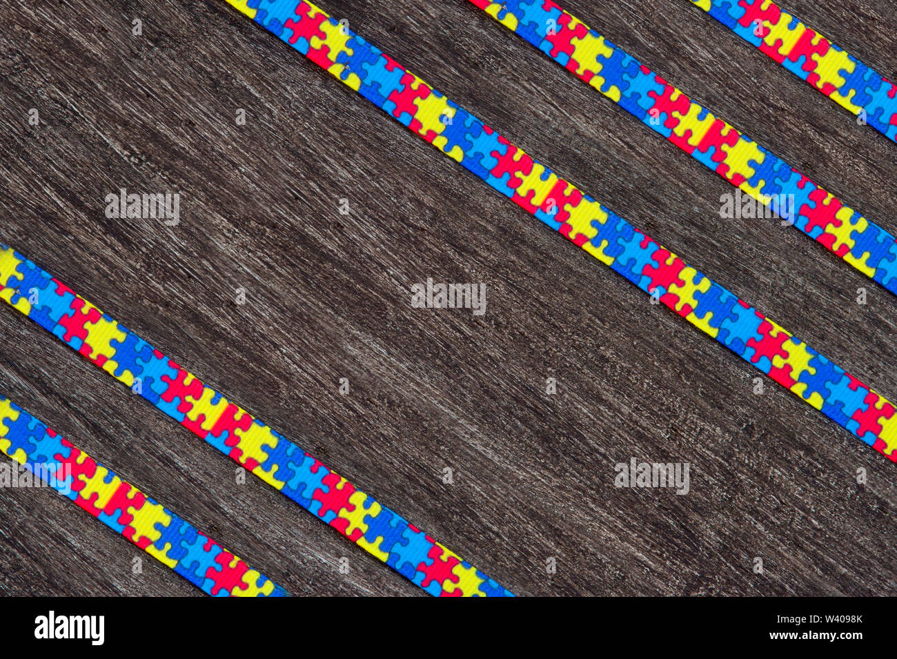 World Autism awareness day with Puzzle ribbon on wooden background ...