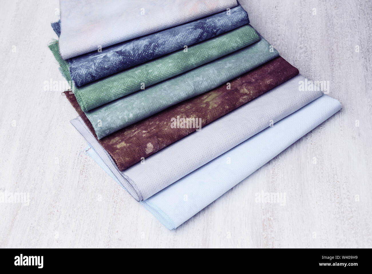 Multi-colored fabric cuts, folded overlap. Fabrics for sewing on a ...